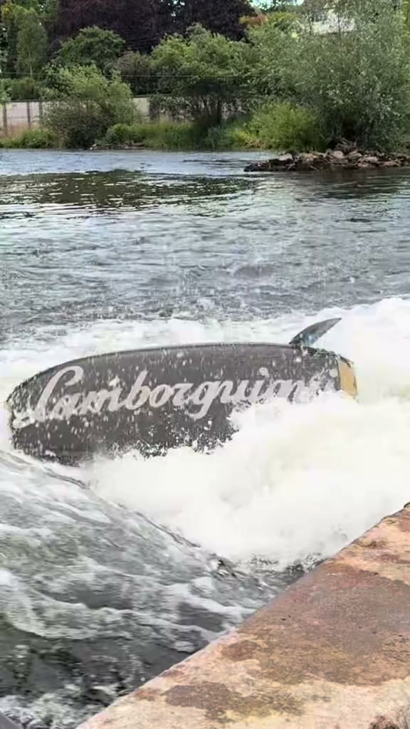 Freestyle kayak flips on a local river wave