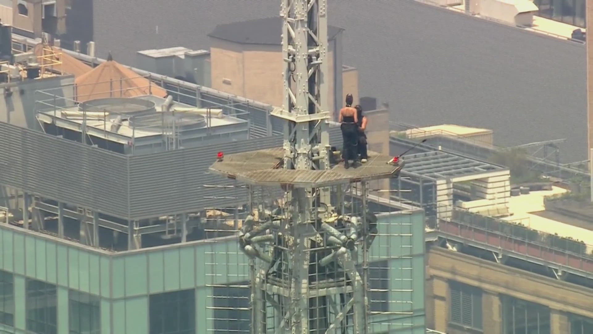 Empire State Building climbers hang banner and get engaged