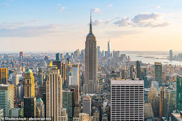 Masked pair scale Empire State Building to very top and fly banner ...