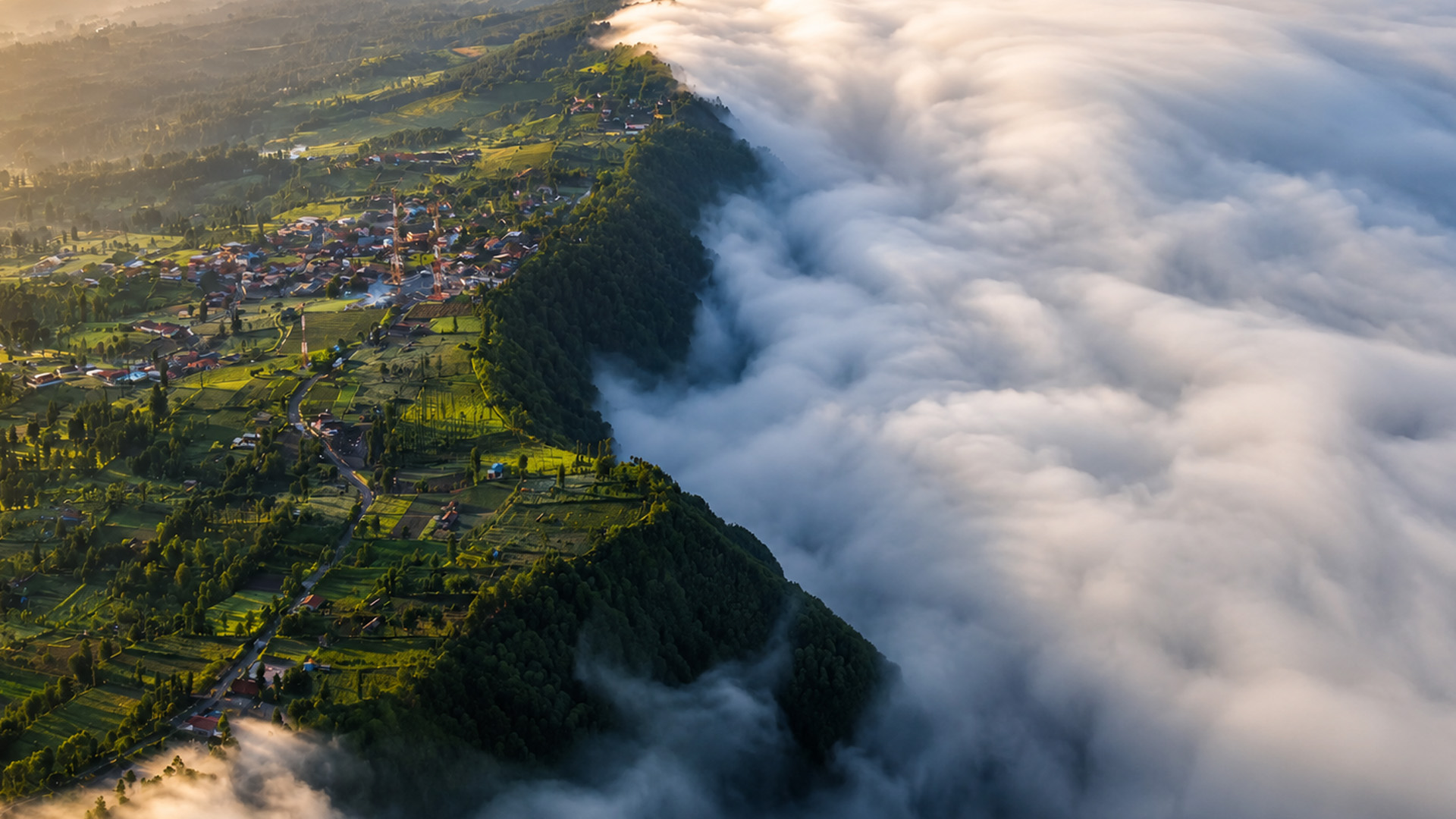 How can a village rise above the fog?
