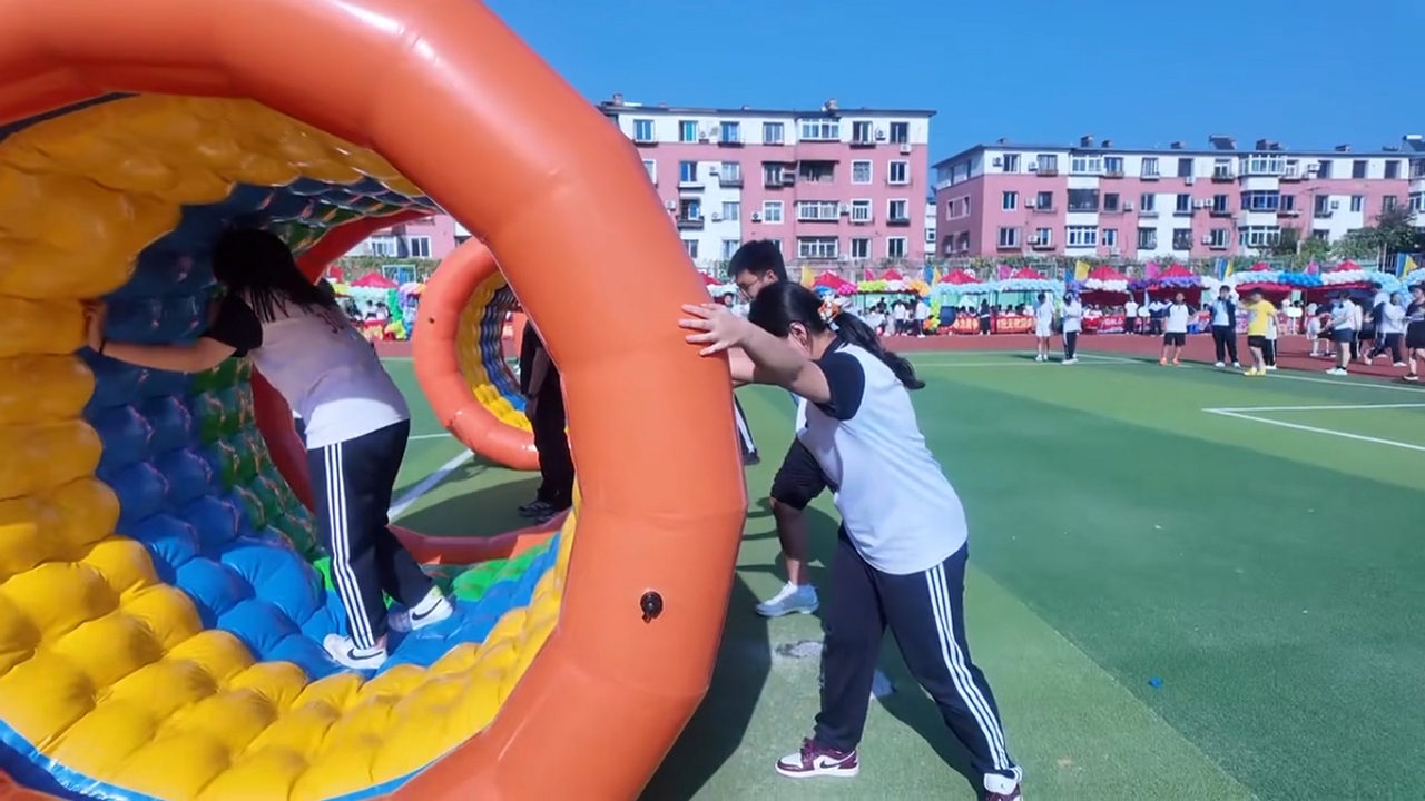 Student spins out in inflatable hamster wheel at school fair