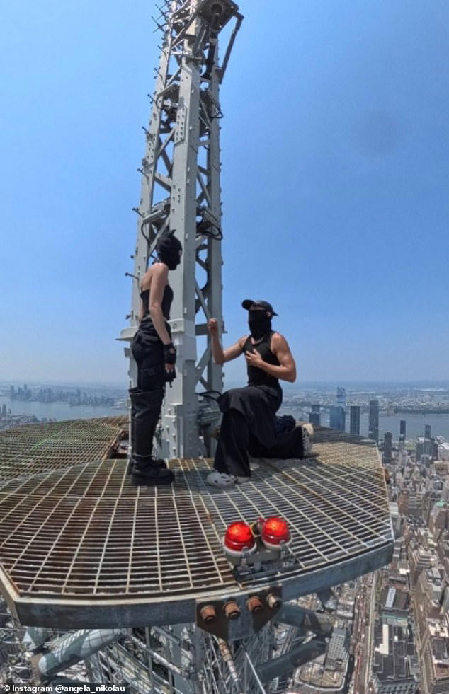 Wild scenes as masked pair scales Empire State Building to fly ...