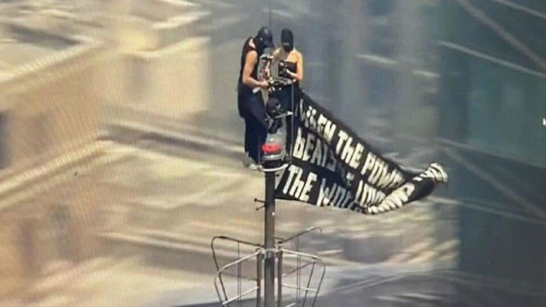 Watch: Couple scales Empire State Building antenna, stages daring ...