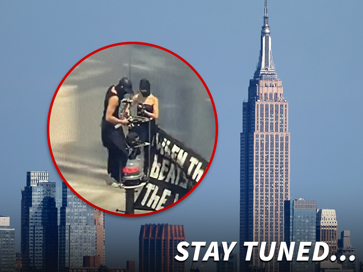 Two people climb to top of Empire State Building, watch live stream