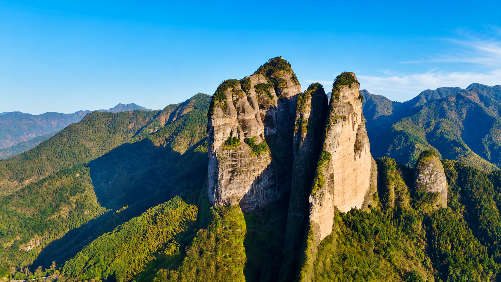 Giant rock pillars rising above Jianglang Mountain