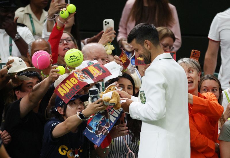 Tennis - Djoker Djokovic scares ball girl, then eyes McIlroy's green jacket