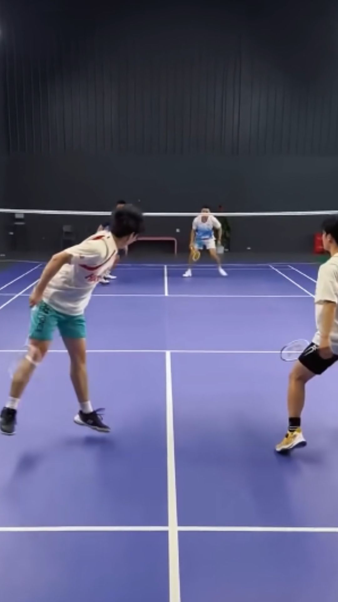 Intense badminton doubles battle