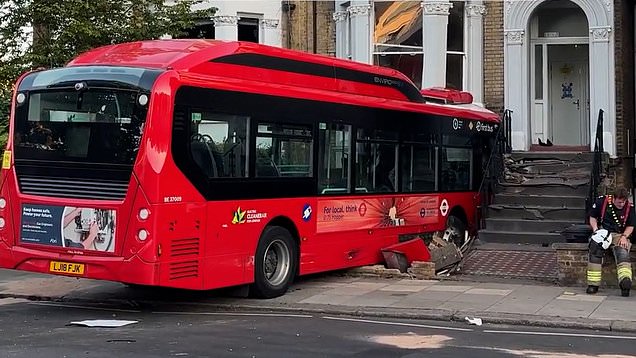 Bus crashes into house in London
