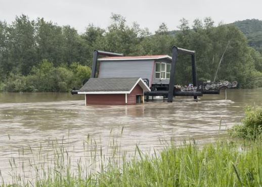 Floodwaters inundate base area at Asessippi