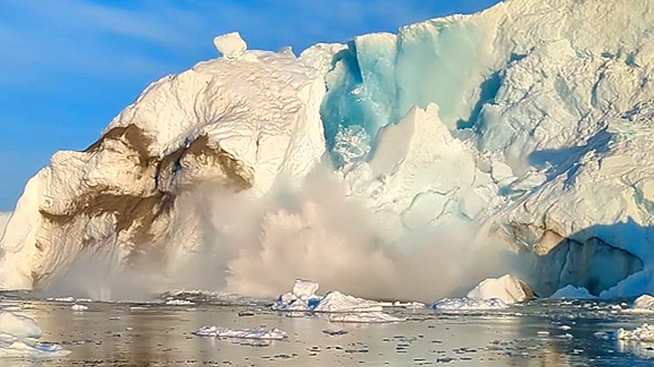 Massive iceberg collapse in Greenland sends huge wave surging towards boat