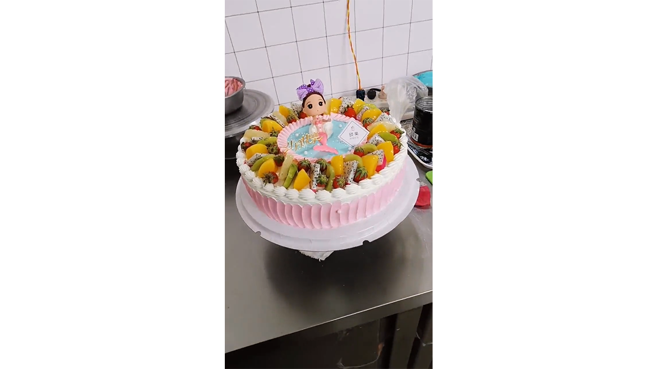 Creating princess birthday cake with vibrant fruit garland and elegant ...