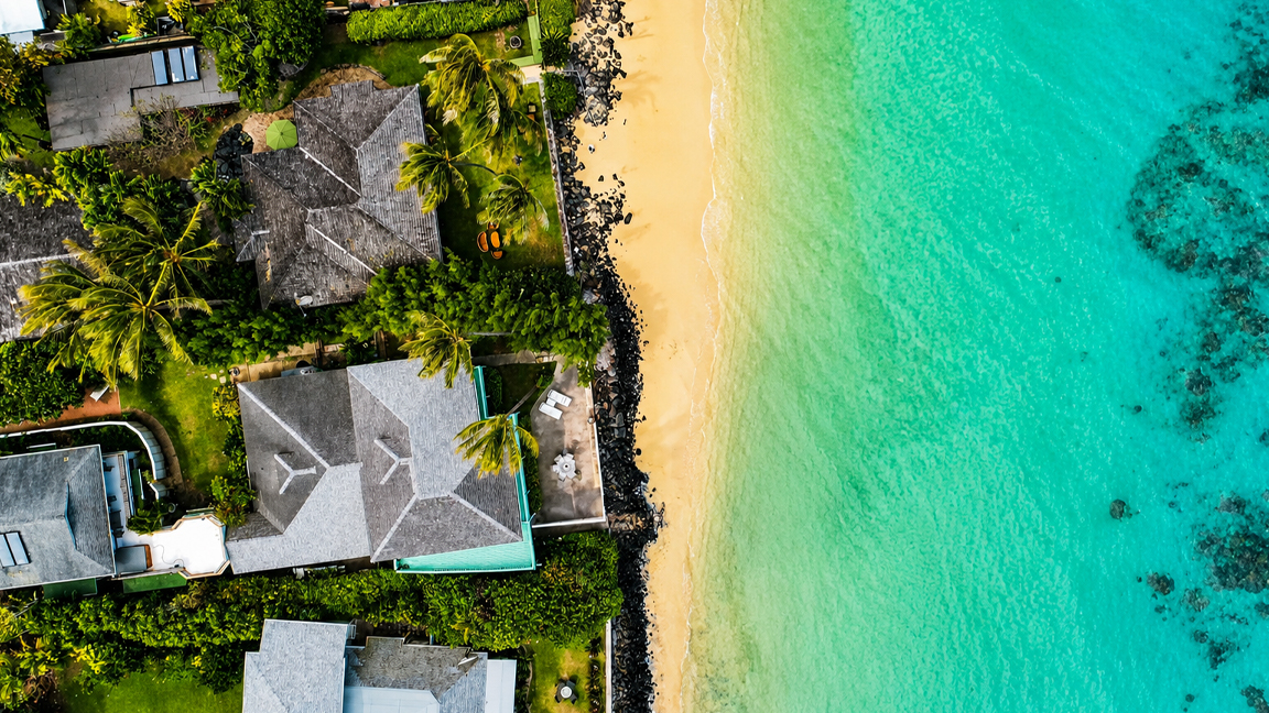 Luxury homes beside Maui’s white sand beach