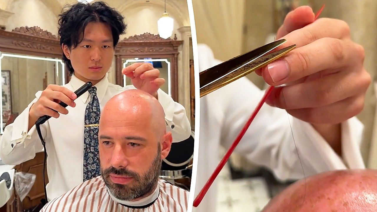 Barber styles a customer's single remaining hair with the greatest care