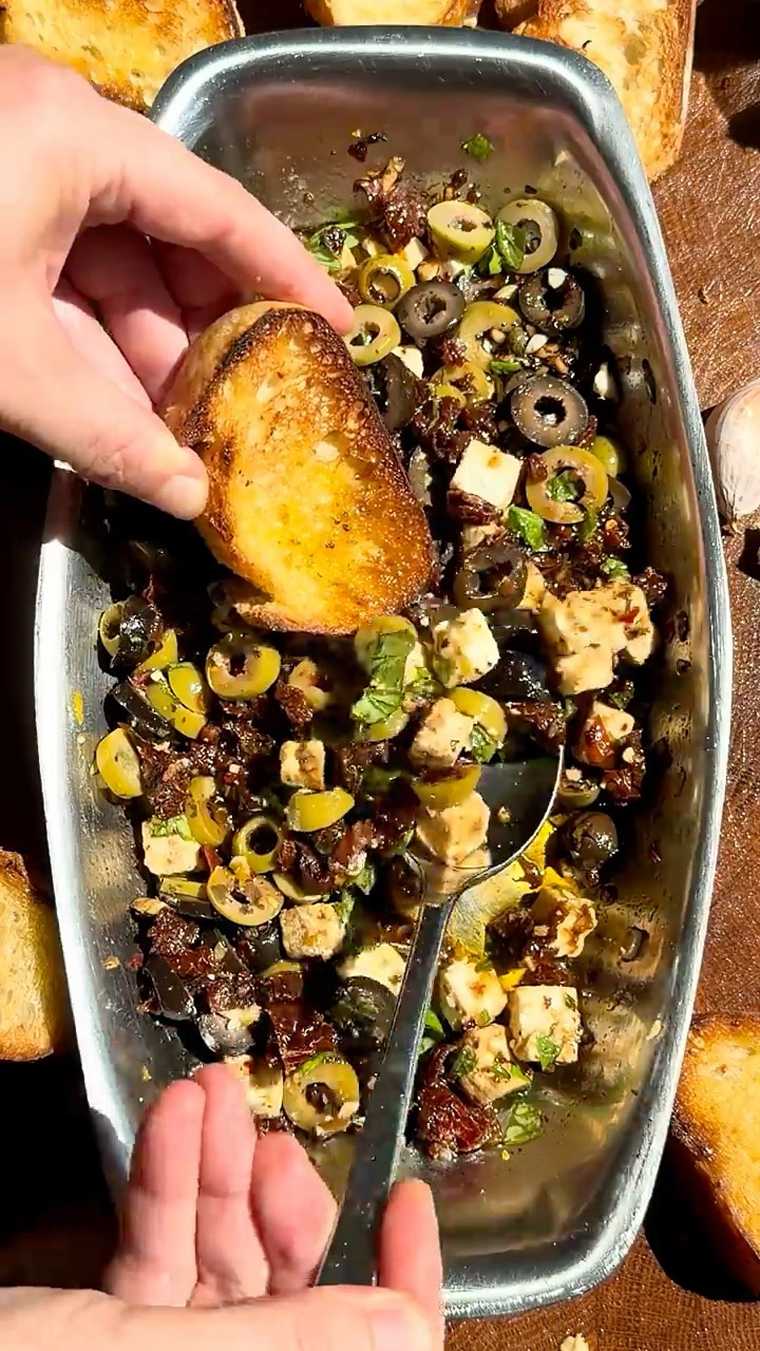 Making a delicious feta olive oil bread dip