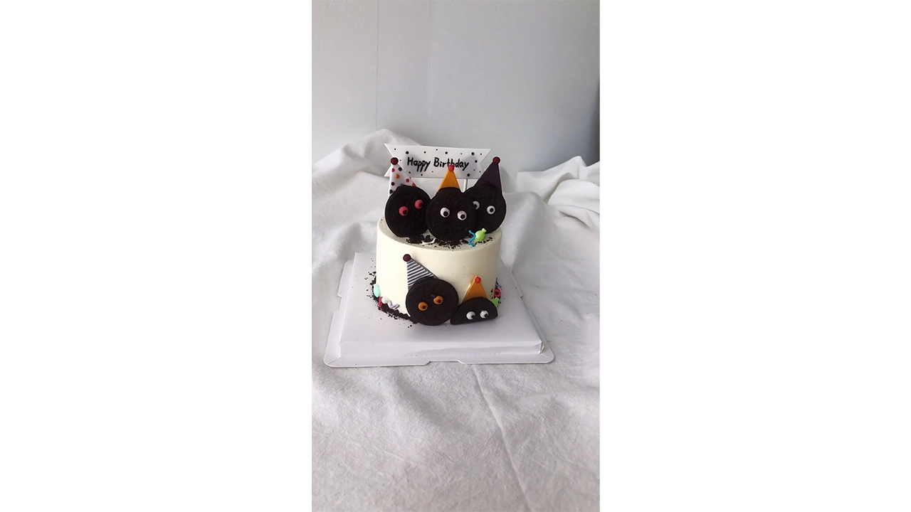 Presenting whimsical cat party cake with handcrafted cartoon toppers ...