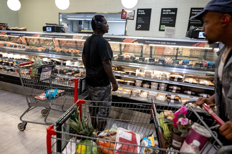 Camden has no grocery stores of its own. A pastor is giving free rides ...
