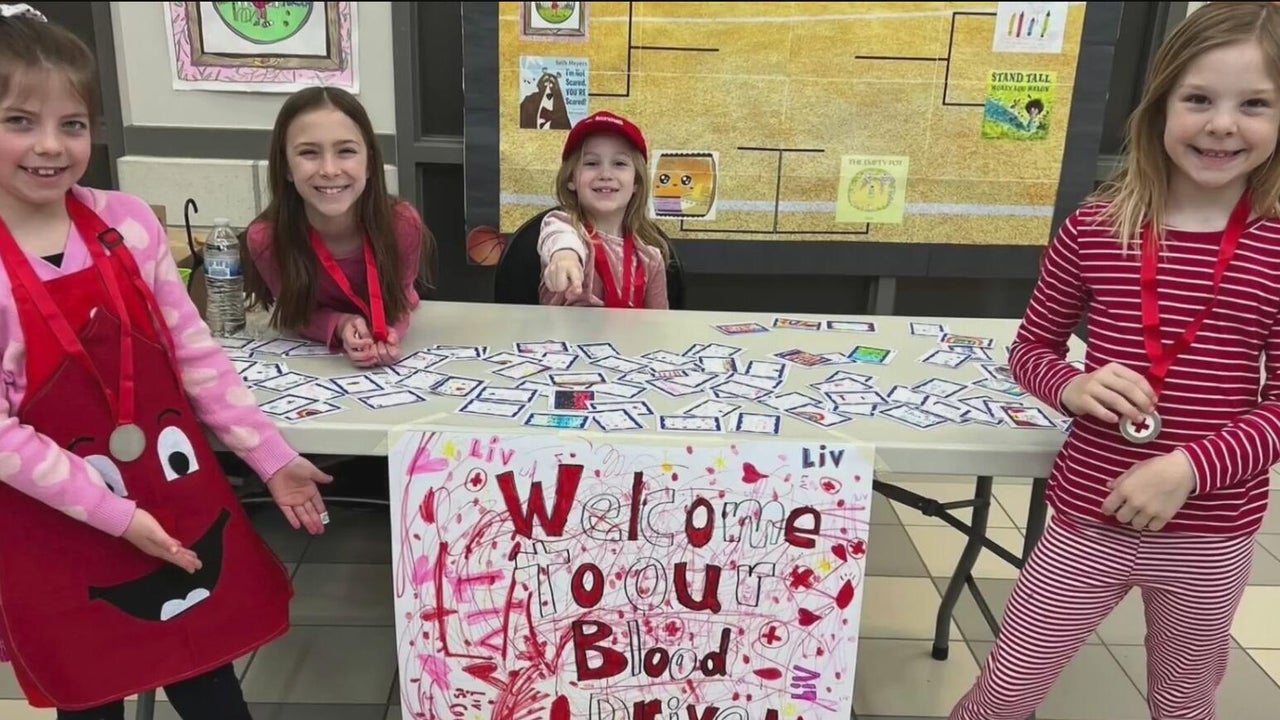Students making bracelets and stickers to sell at blood drive