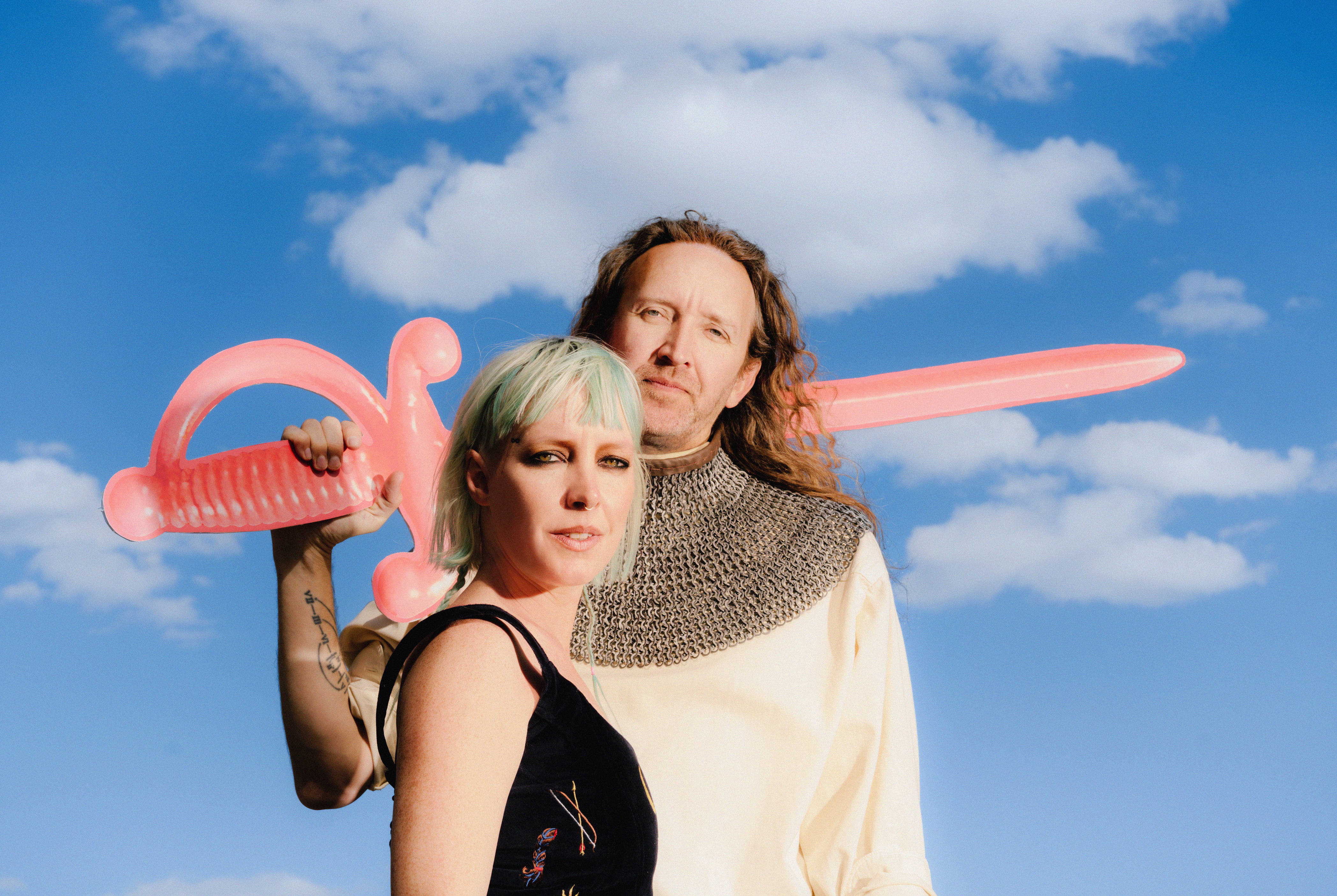 A married synth-pop duo used to go it alone. Now, they're bringing ...