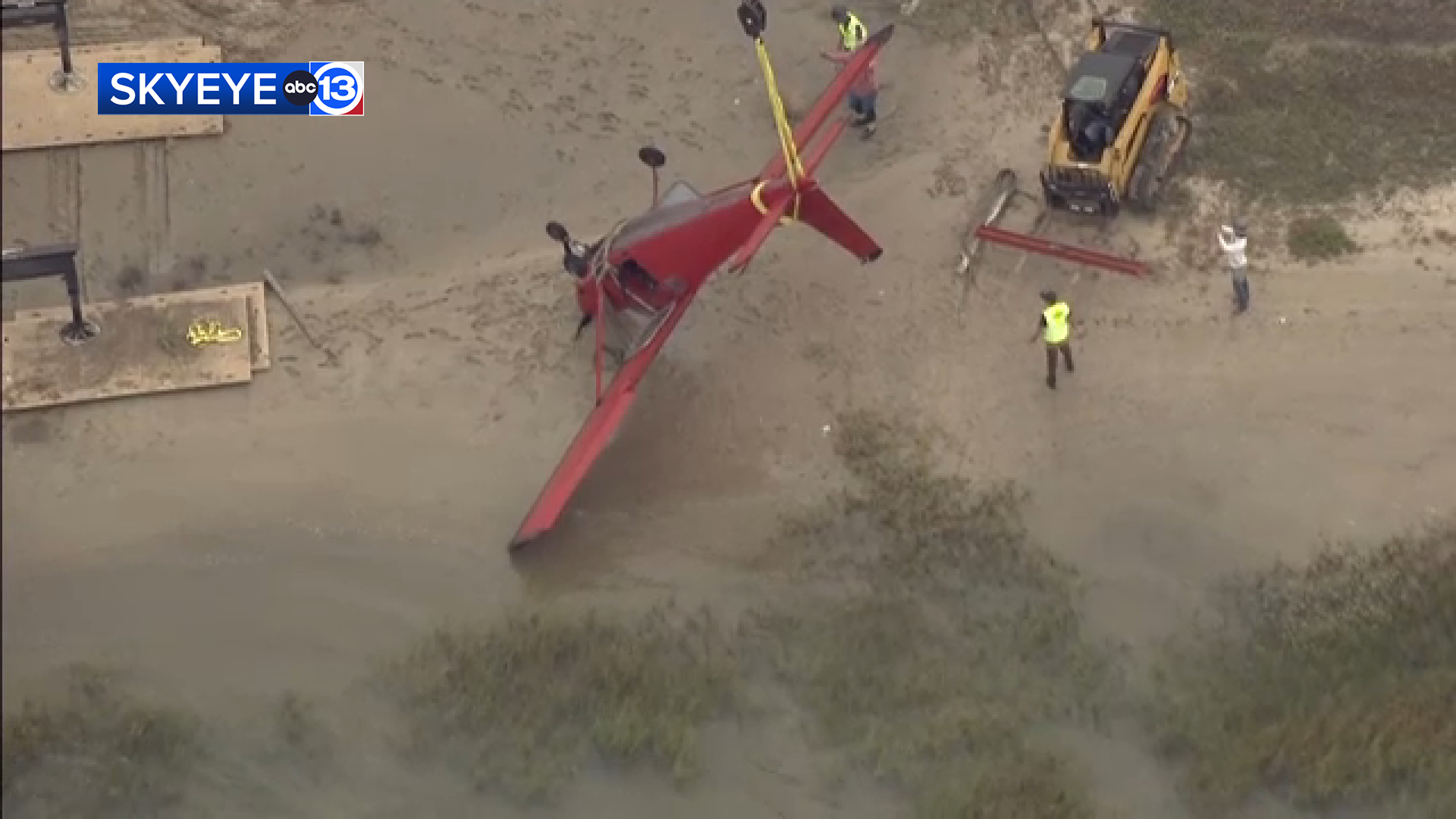 Small Plane Retrieved By Crane After Overturning Into Water During