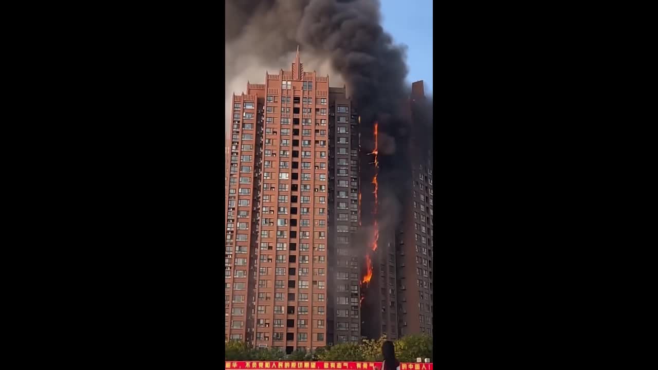 Raging fire tears through high-rise apartment building in China