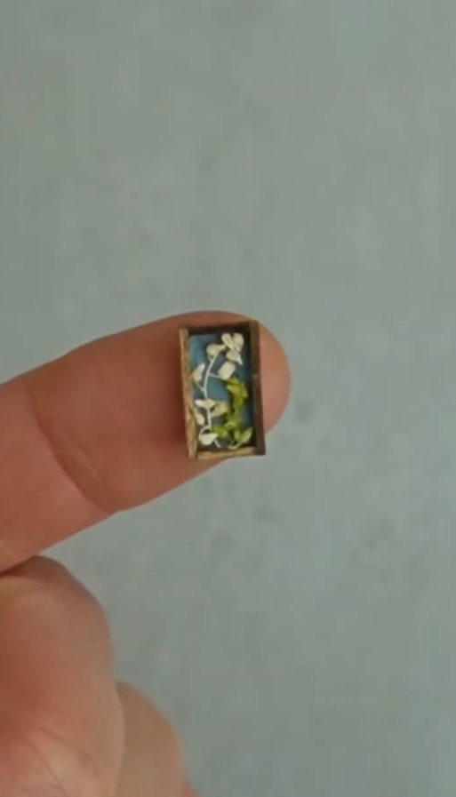 Creating a miniature shadow box from recycled materials