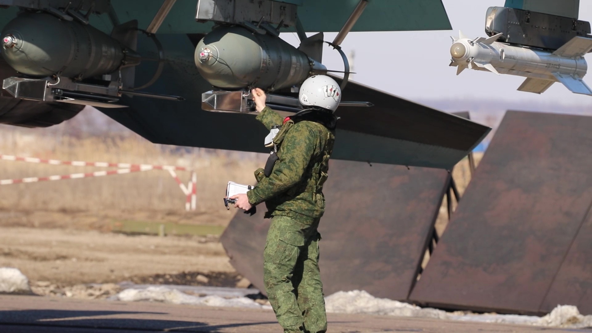 Russian military pilot is shown descending by parachute after his ...