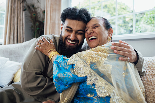 What does Eid Mubarak mean and how should you reply to the greeting?