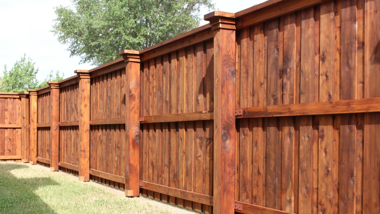 Adding trim and a gate to a cedar fence