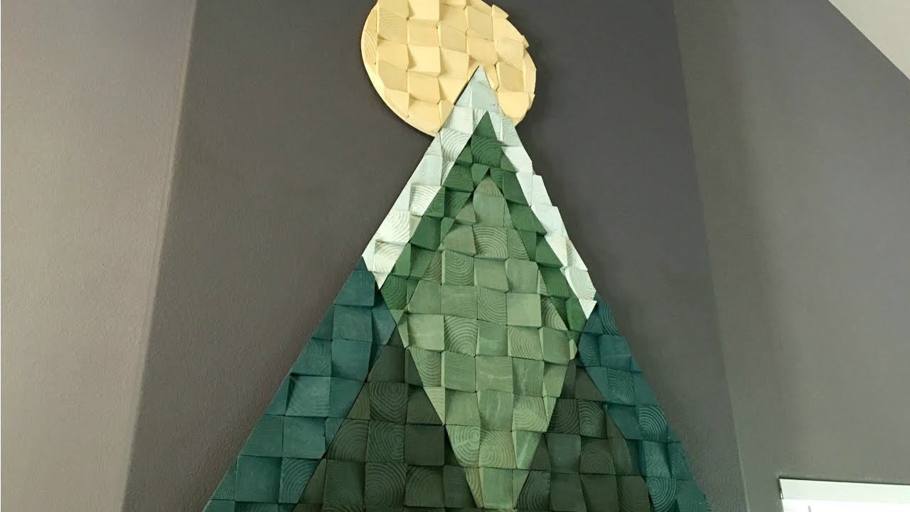 Create scrap wood art with an abstract mountain design