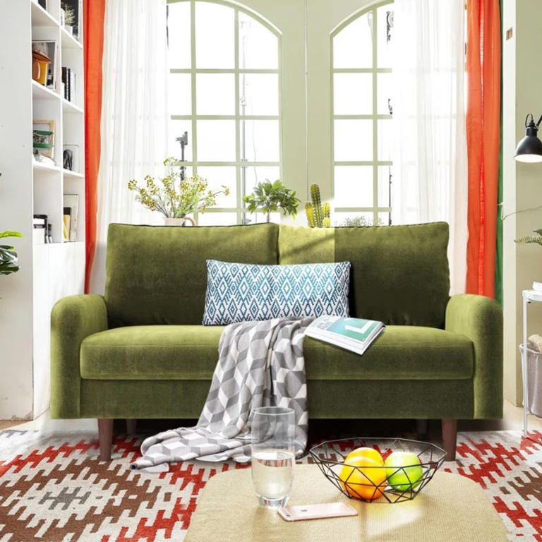 Victoria Beckham uses a green sofa to create an on-trend focal point in her dressing room ...