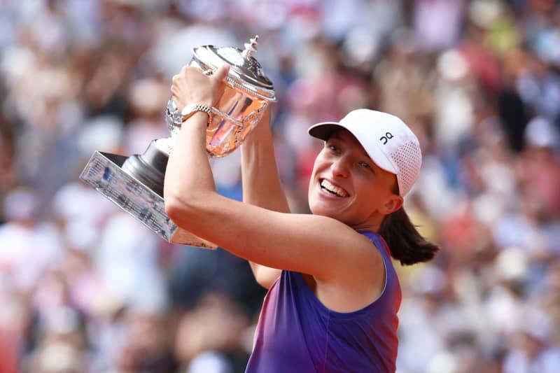 Clay queen Swiatek routs Paolini for fourth French Open title Clay queen Swiatek routs Paolini for fourth French Open title