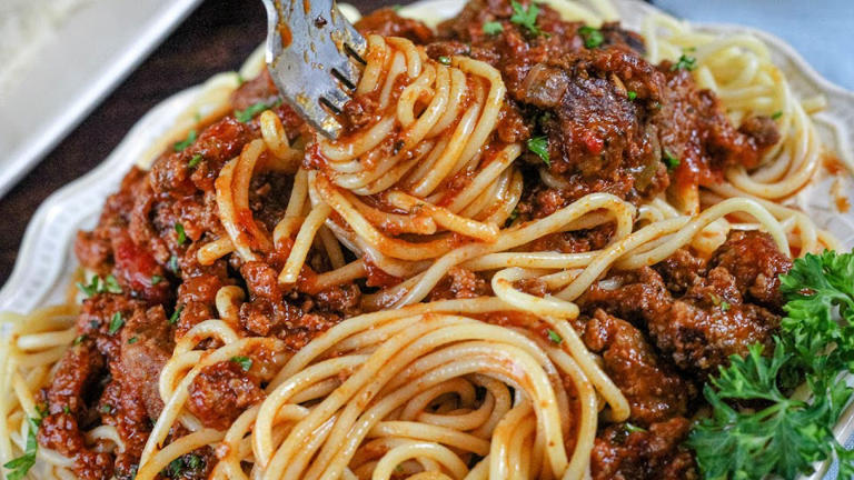 As This Old-fashioned Spaghetti Sauce Simmers On Your Stove All Day It ...