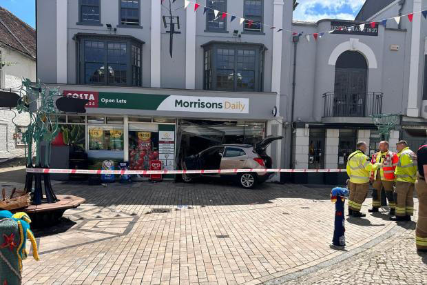 Four injured after car 'loses control' and smashes into Morrisons shopfront Four injured after car 'loses control' and smashes into Morrisons shopfront