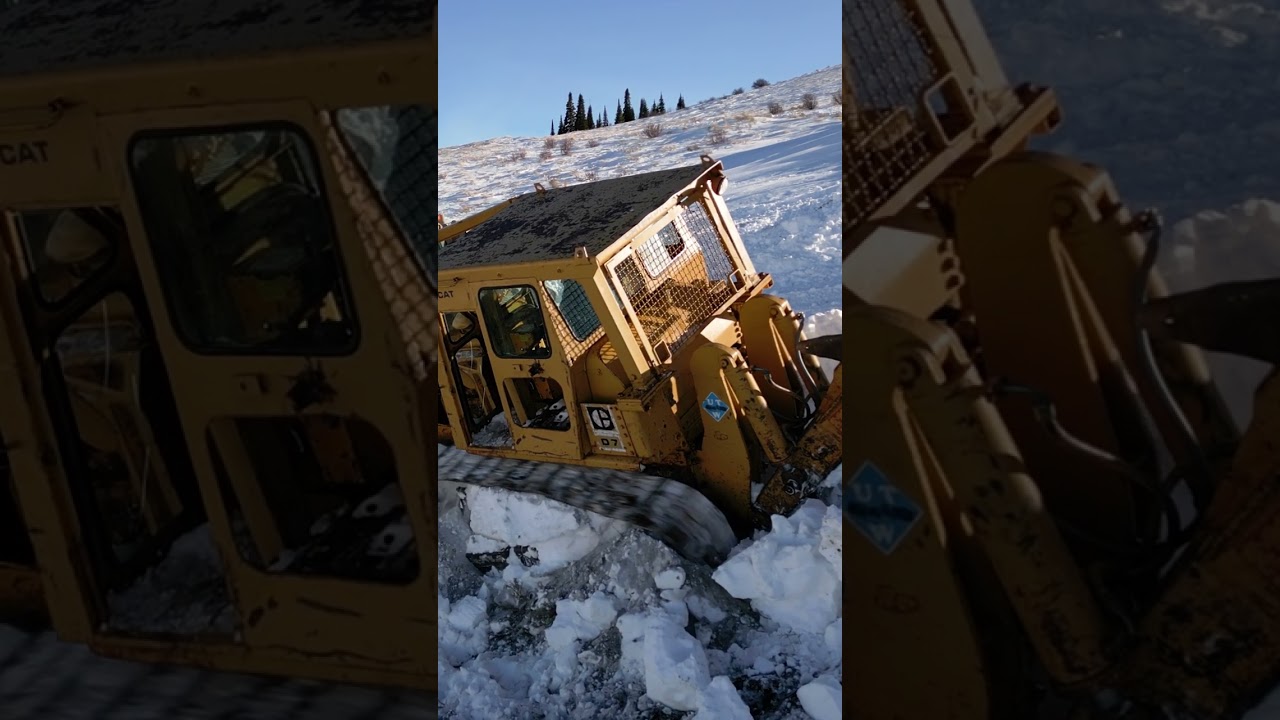 Stuck Bulldozer Rescued in a High-Risk Snowcat Operation