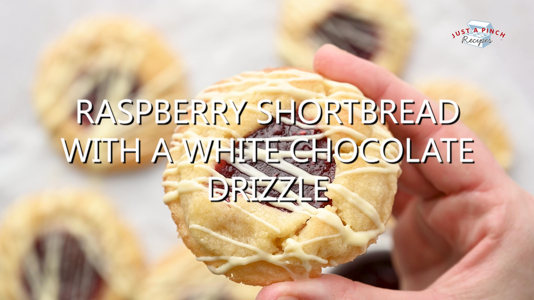 Raspberry shortbread cookies with a white chocolate drizzle