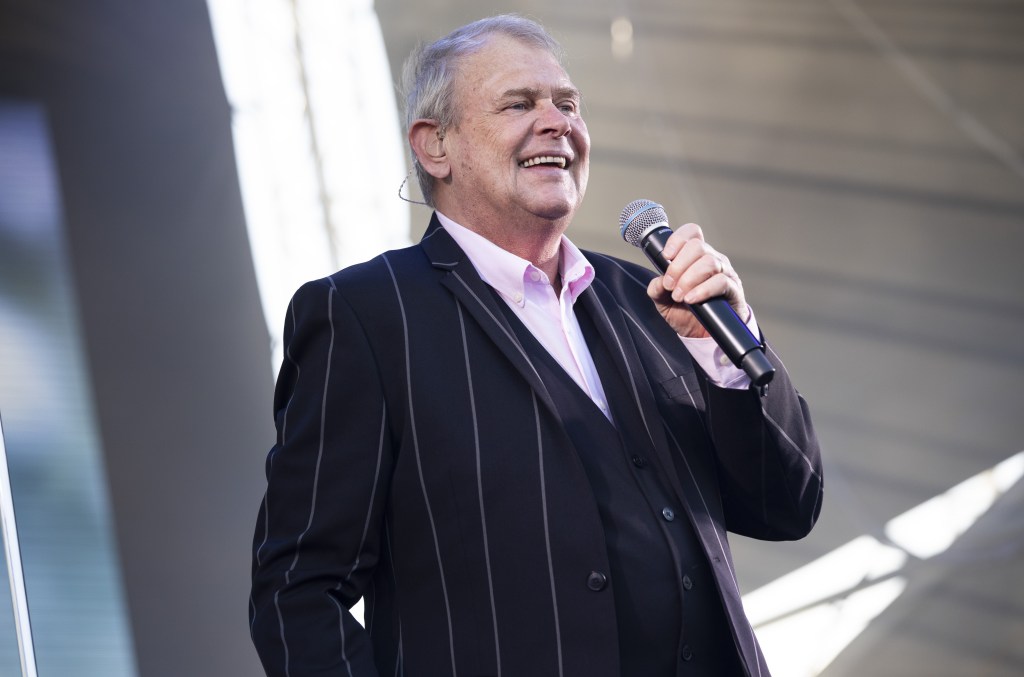 John Farnham makes rare public appearance following cancer treatment