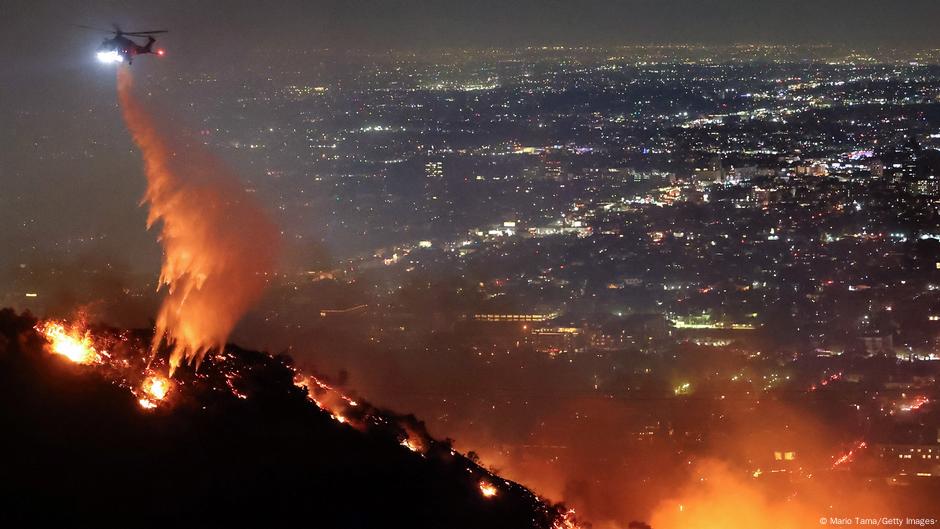 Los Angeles firefighters battle to control devastating fires