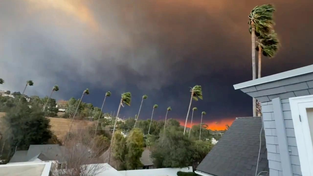 Smoke from the Eaton Fire shrouds homes in Glendale, California