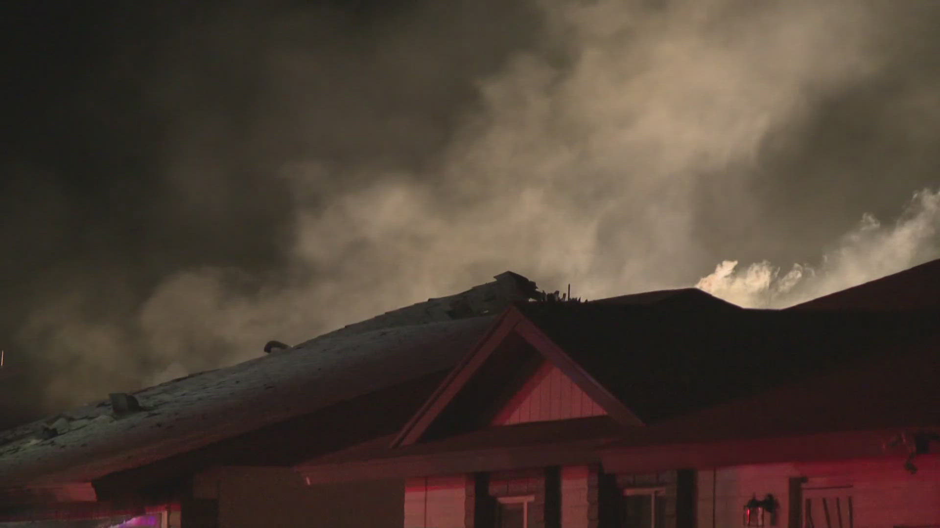 Double house fire in west Phoenix leaves woman dead