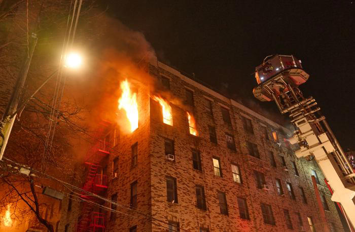 Five-alarm fire tears through Bronx apartment building, injuring seven