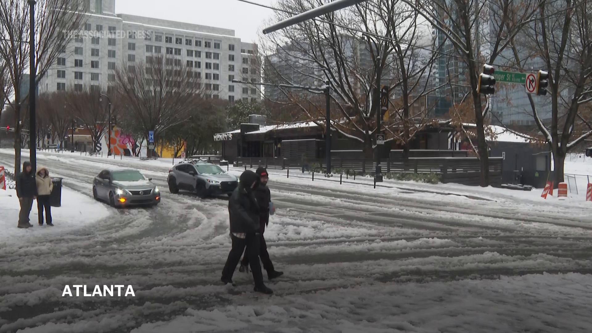 Winter storm plods into the Deep South; snow blankets Atlanta