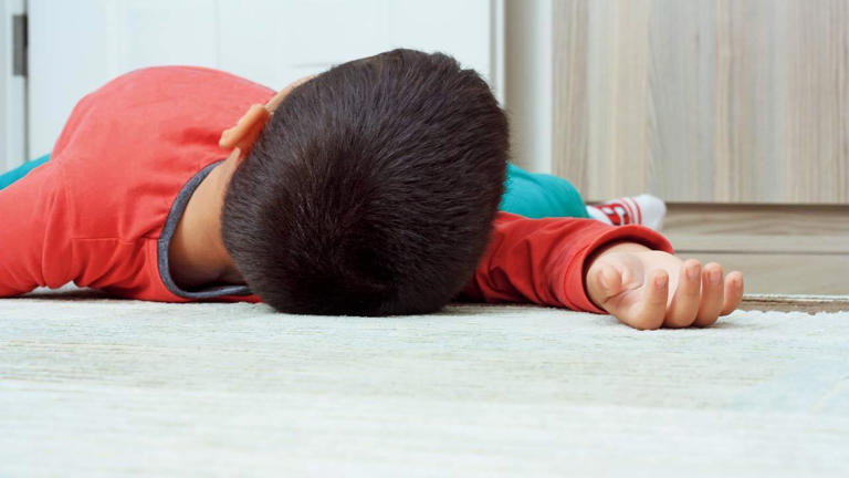 Woman strangles 10-year-old son with phone charging cable