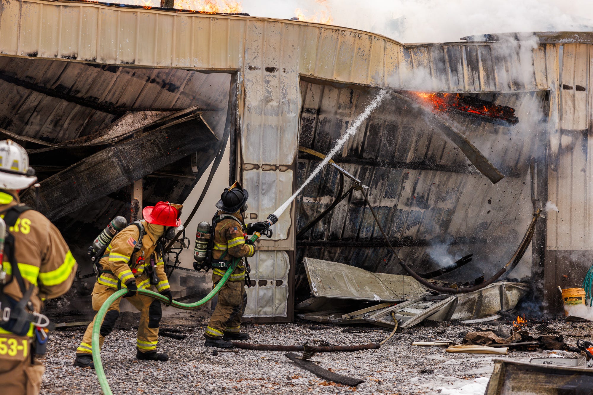 Officials: No injuries after burn pit accidentally burns down garage in ...