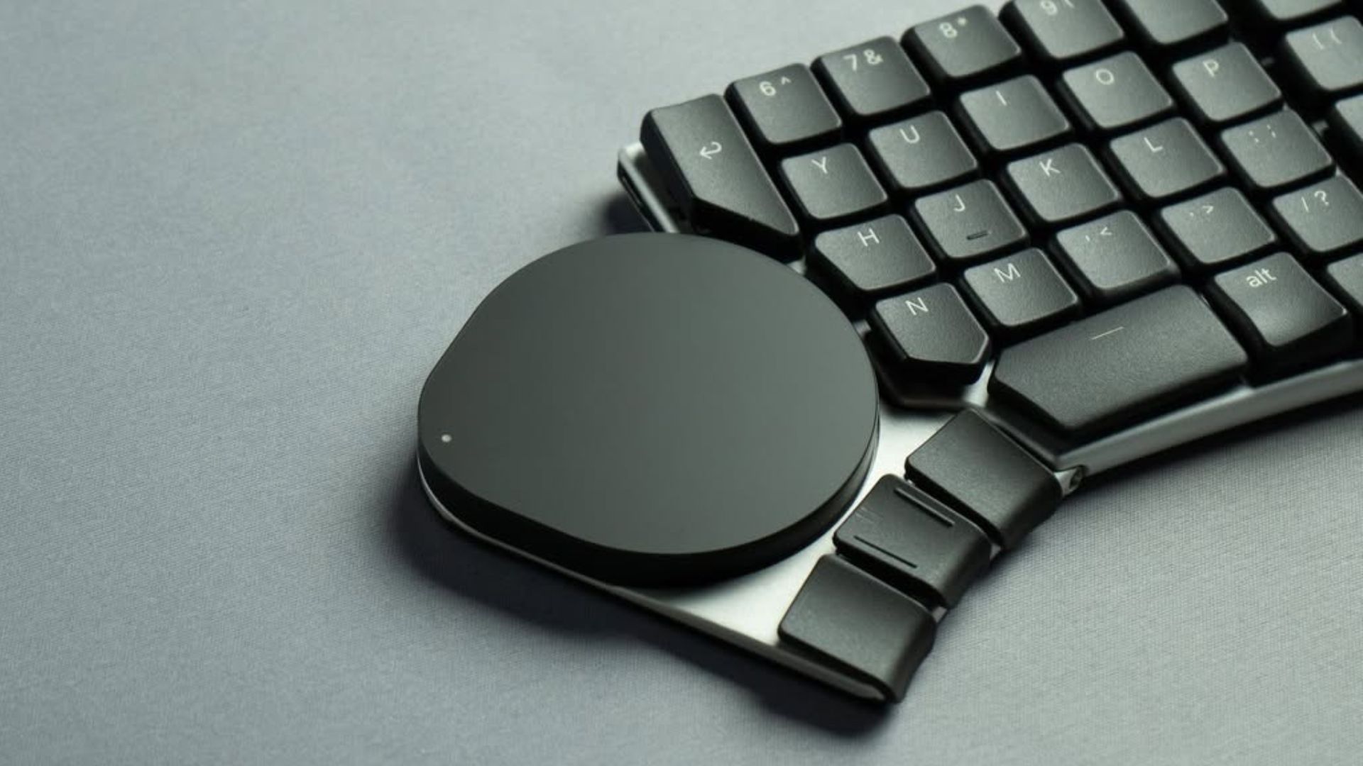 Photos: New customizable keyboard lets you switch between touchpad ...